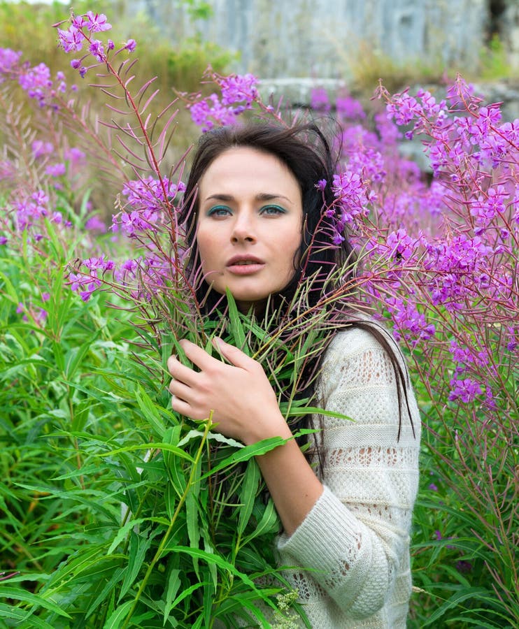 Young Woman Posing among the Flowers Stock Image - Image of foliage ...