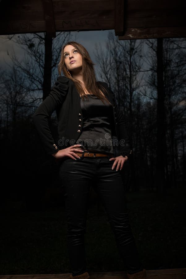 Young Woman Posing and Looking Up Stock Photo - Image of outdoors ...