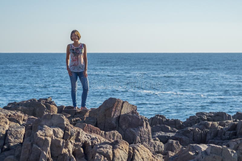 Young Woman Posing on Rocks by the Black Sea Stock Photo - Image of ...