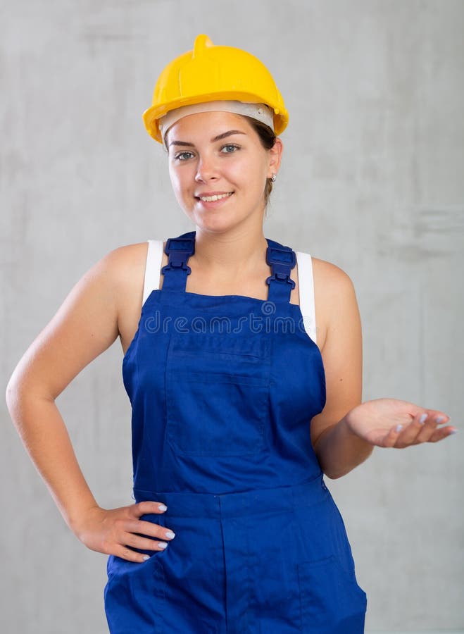 Young Woman Posing in Work Overalls in Studio Stock Photo - Image of ...