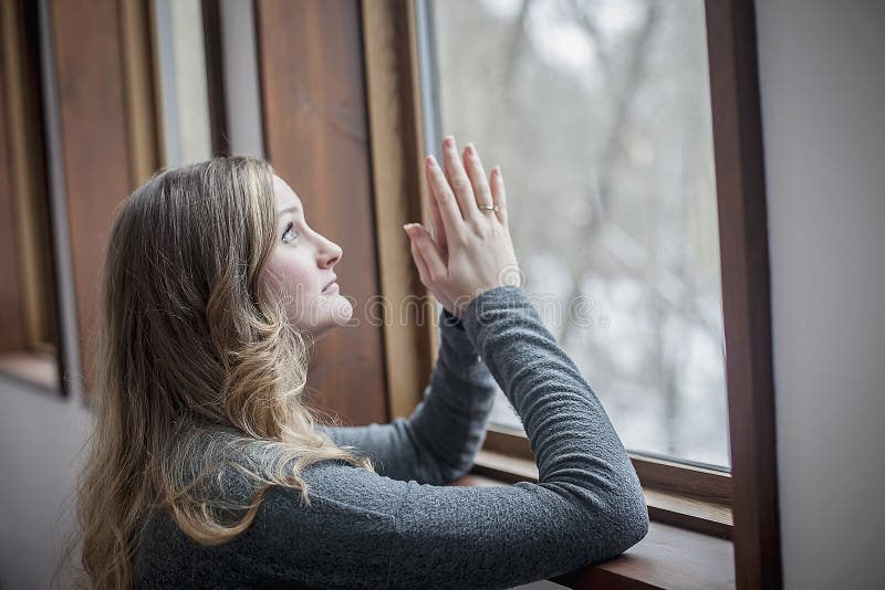 Young Woman Praying by Window Stock Image - Image of meditate, prayer ...