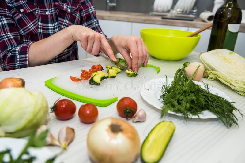 Young Woman Preparing Dinner in a Kitchen. Healthy Lifestyle Stock ...