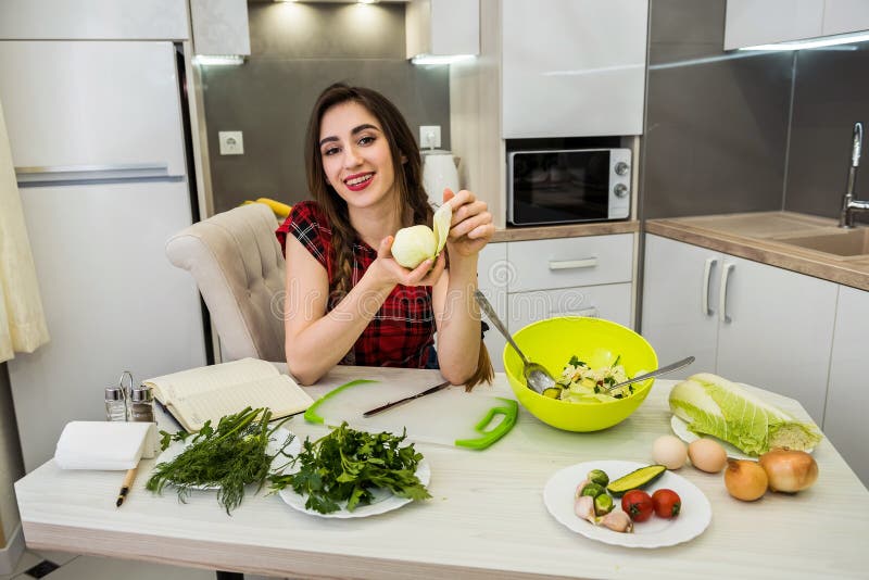 Young Woman Preparing Dinner in a Kitchen. Healthy Lifestyle Stock ...