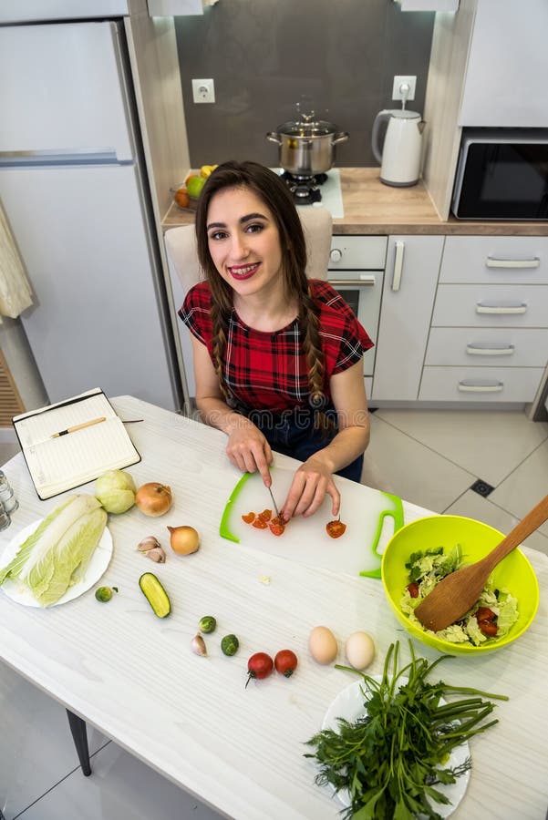 Young Woman Preparing Dinner in a Kitchen. Healthy Lifestyle Stock ...