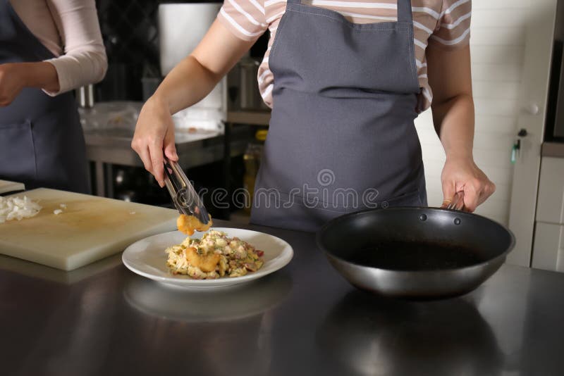 Young Woman Preparing Meal during Cooking Classes on Restaurant Kitchen ...
