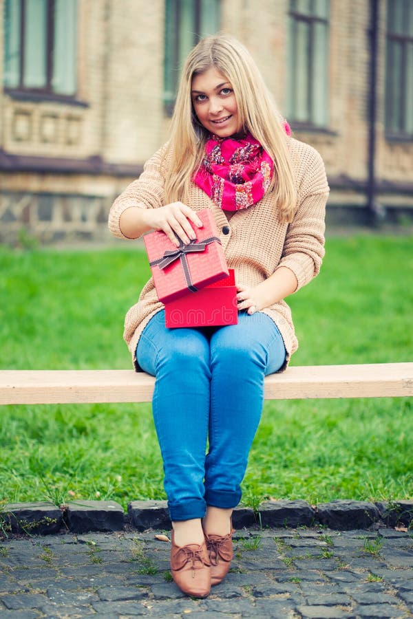 Young woman with present stock photo. Image of beautiful - 34850118
