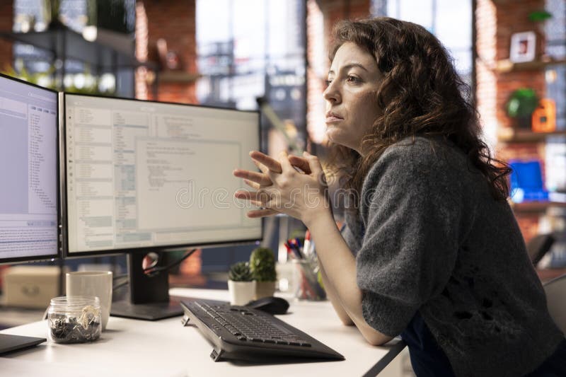 Young Woman Programming Software Code on Her Computer, Stock Photo ...