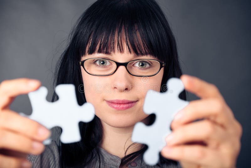 Young Woman with Puzzle Pieces Stock Photo - Image of puzzle, glasses ...