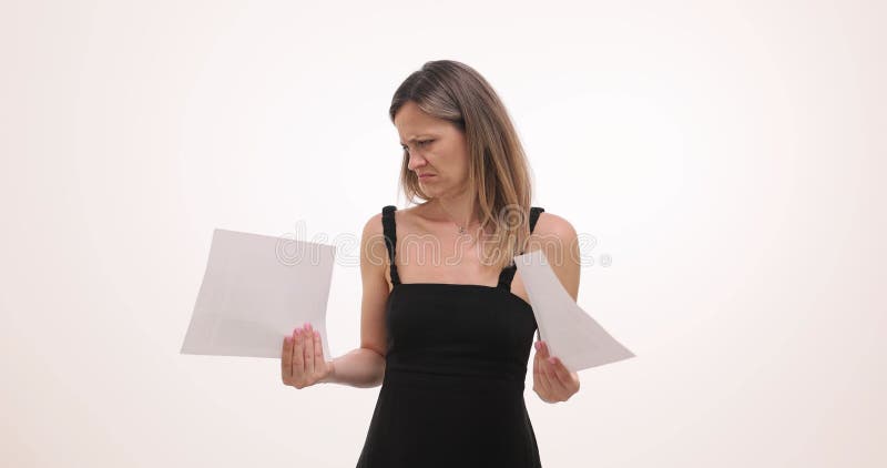 Young Woman with Puzzled Expression Examines Documents Stock Footage ...
