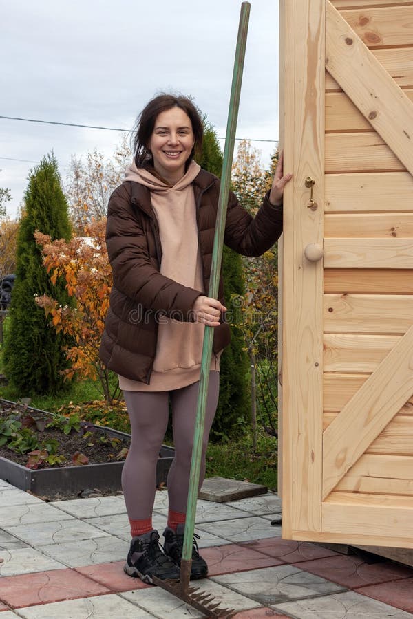 Young Woman with a Rake on the Farm Stock Image - Image of woman, cute ...
