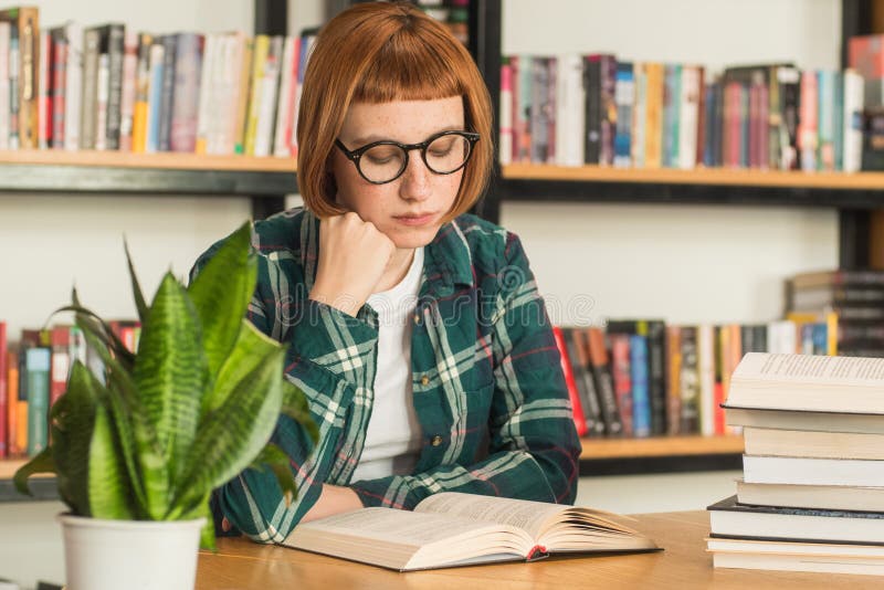 Young woman read book stock photo. Image of bookshelf - 144257286
