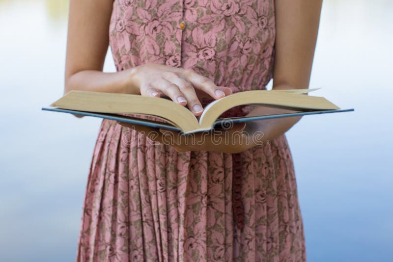 Young Woman Reading Bible in Natural Park Stock Photo - Image of ...