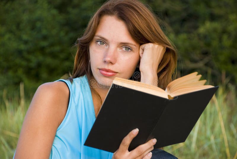 Young woman reading book stock image. Image of leisure - 10615229