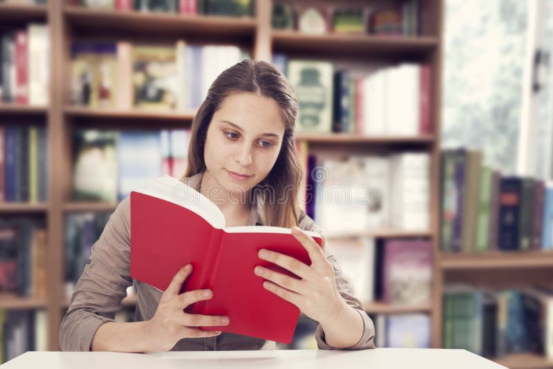 Young woman reading book stock image. Image of teenager - 71520699