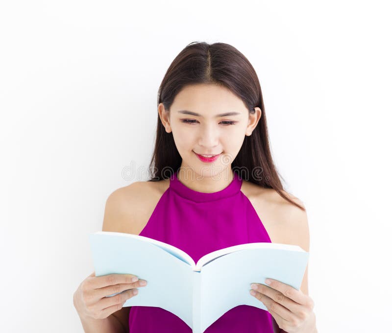 Young Woman Reading Book Against White Wall Stock Image - Image of ...