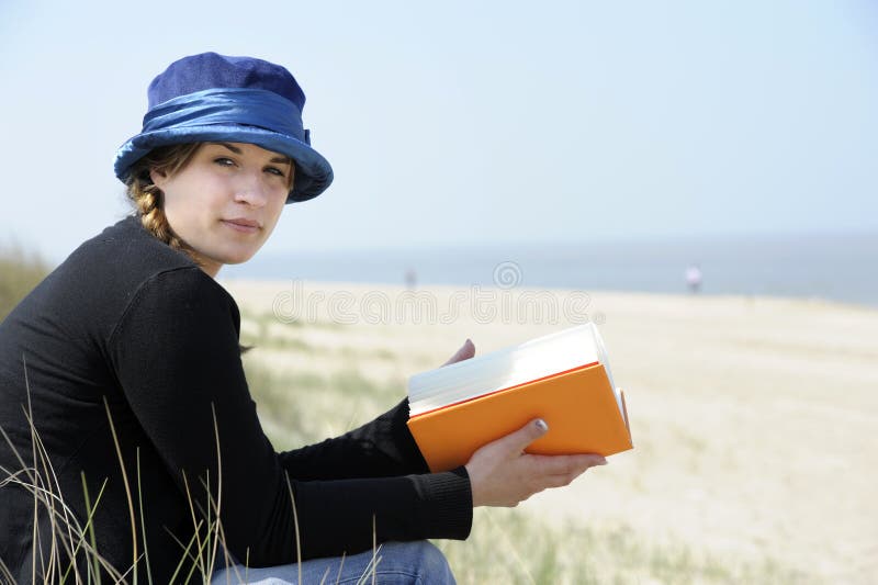 Young Woman Reading a Book at the Beach Stock Photo - Image of ...
