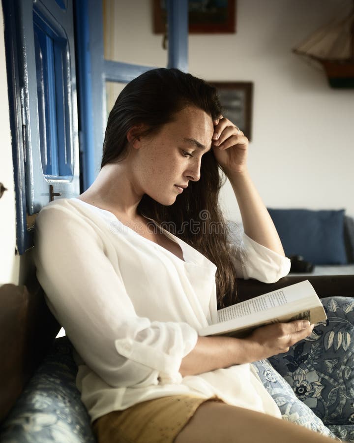 Young woman reading book stock image. Image of indoors - 33670107