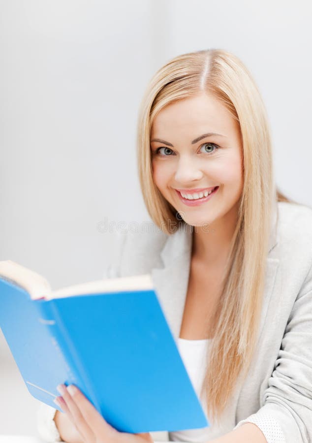 Young woman reading book stock image. Image of preparation - 31585745