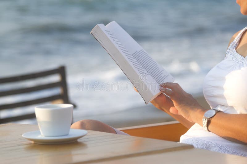 Reading a Book at the Seaside Stock Image - Image of book, reading ...