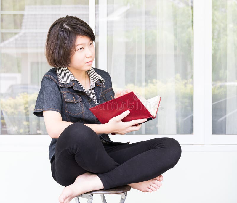 Young Woman Reading Book Sitting On Chair Stock Image Image Of Adult