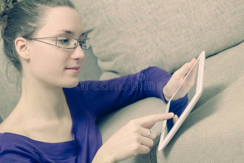 Young Woman Using Digital Tablet at Home Stock Photo - Image of ...