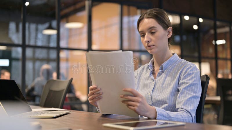 Young Woman Reading Documents at Work, Paperwork Stock Photo - Image of ...