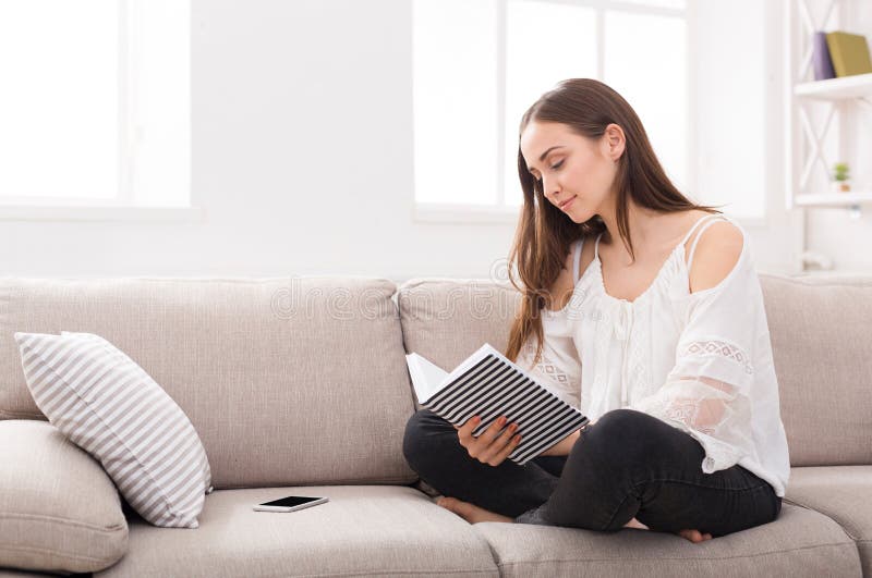 Young Woman Reading Her Notes Stock Photo - Image of candid, pretty ...