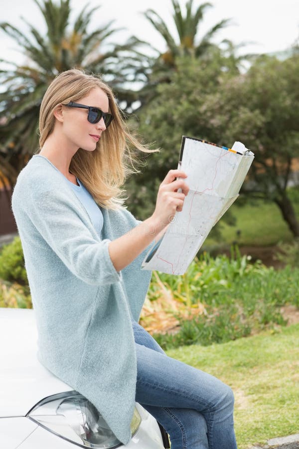 Young woman reading a map stock image. Image of lifestyle - 50491605