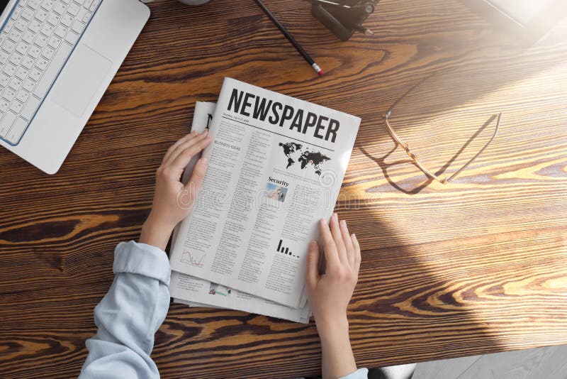 Young Woman Reading Newspaper at Table Stock Image - Image of sitting ...