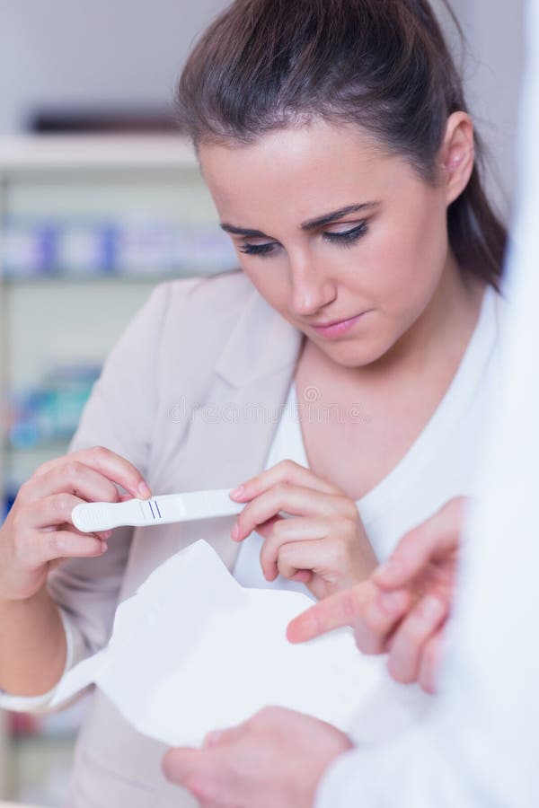 Young Woman Reading Pregnancy Test Stock Image - Image of coat, woman ...