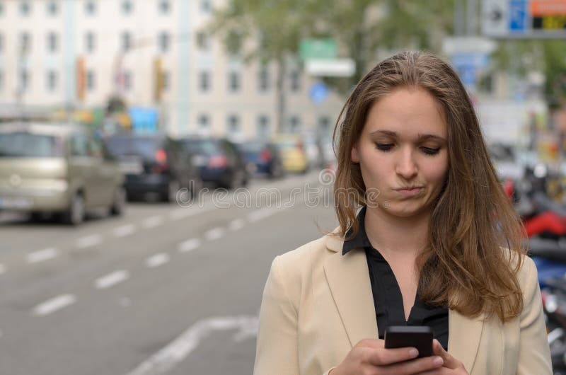 Young Woman Reading a Text Message on Her Mobile Stock Image - Image of ...