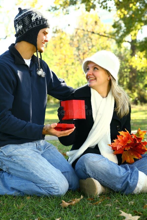 Young Woman Receive a Gift stock image. Image of park - 7711115