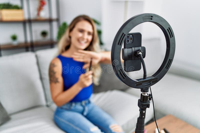 Young Woman Recording Makeup Tutorial by Smartphone at Home Stock Image ...