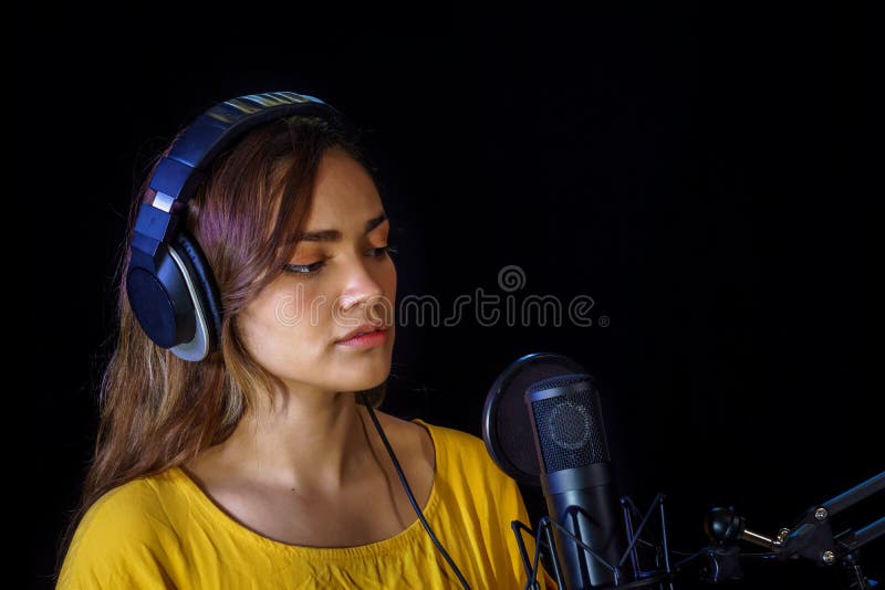 Young Woman Recording a Song in a Professional Studio Stock Image ...