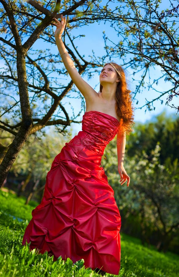 Young woman in red dress stock photo. Image of outdoors - 14833512