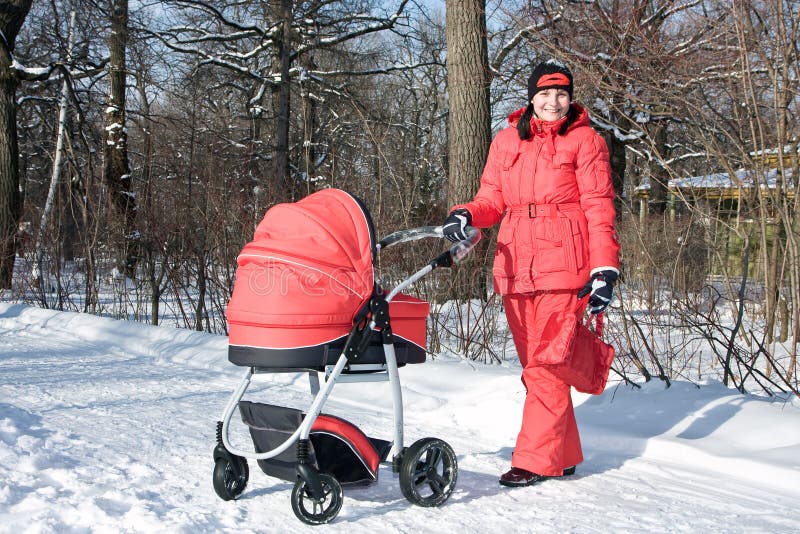 Young Woman in Red with Red Baby Carriage Stock Photo - Image of ...