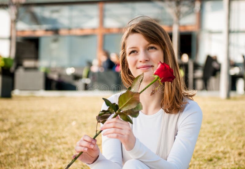 Young woman with red rose stock photo. Image of beautiful - 28397526