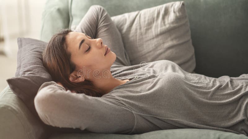 Young Woman Relax Rest on Sofa in Living Room Stock Image - Image of ...