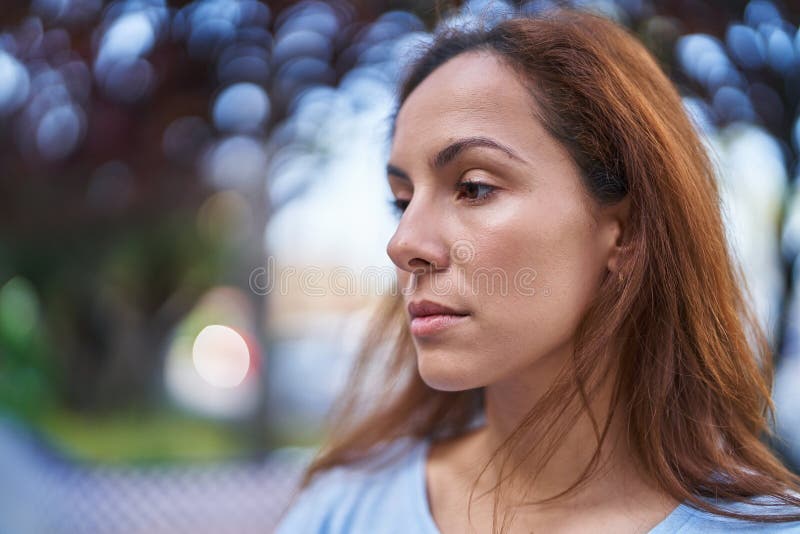 Young Woman with Relaxed Expression Standing at Park Stock Image ...