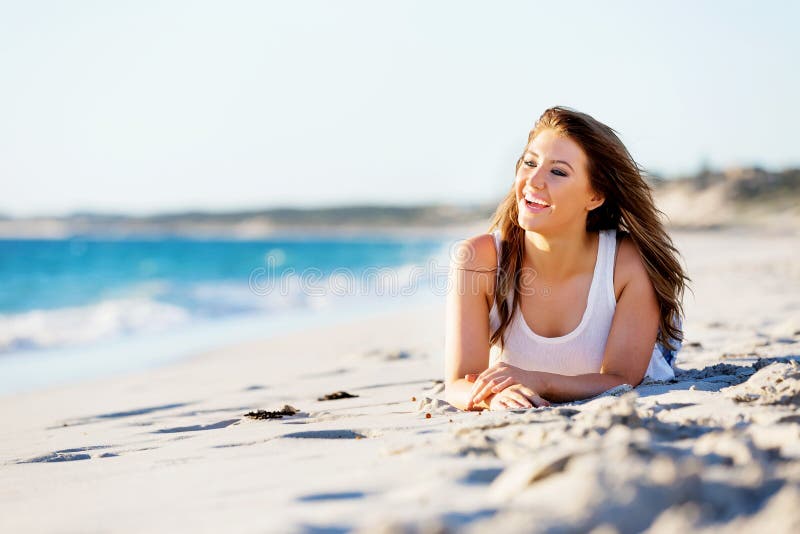 Young Woman Relaxing on the Beach Stock Photo - Image of pretty ... Young Woman Relaxing on the Beach Stock Photo - Image of pretty ...