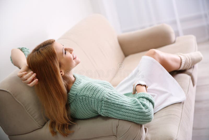 Young Woman Relaxing on Couch Stock Image - Image of casual, couch ...