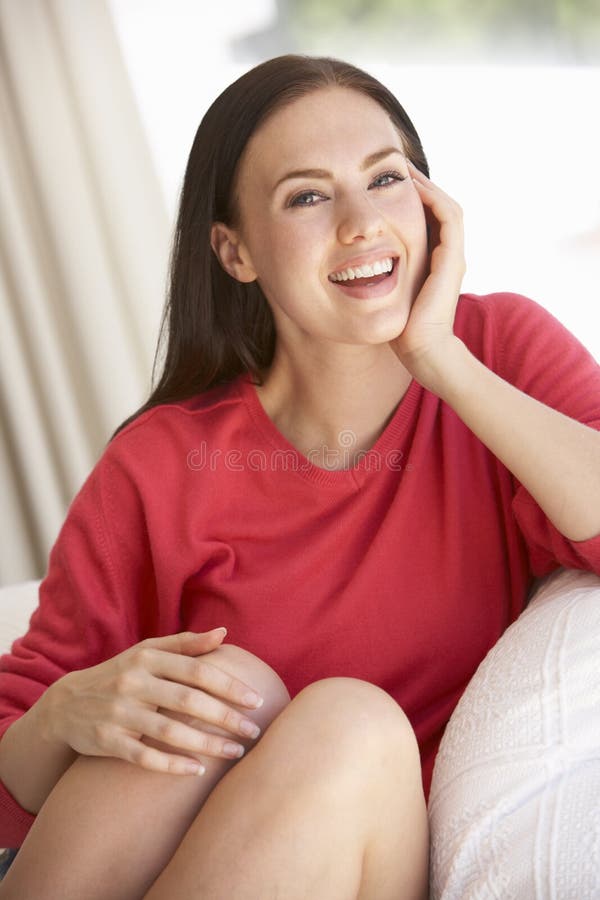 Young Woman Relaxing at Home Stock Image - Image of sitting, smiling ...