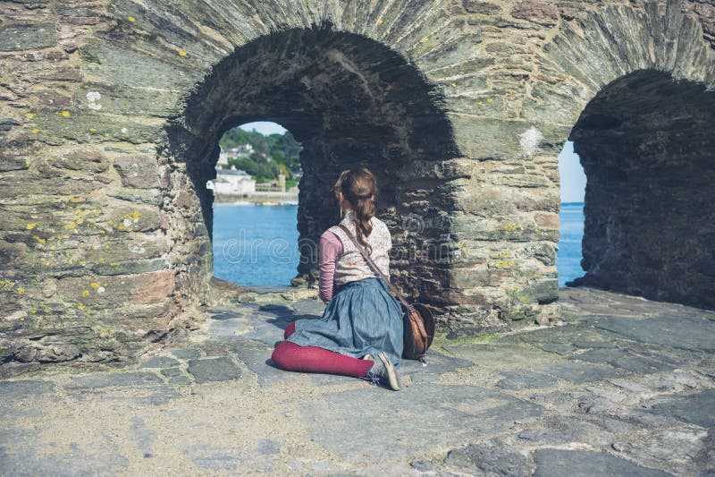 Young Woman Relaxing Under Stone Wall Arch Stock Photos - Free ...