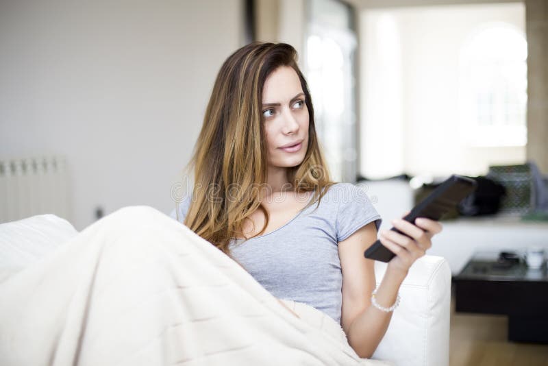 Young Woman with Remote Control Stock Image - Image of attractive, cute ...
