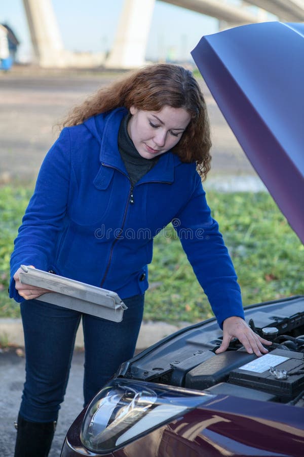 Young Woman Repairing Car Engine with Touchpad Stock Image - Image of ...
