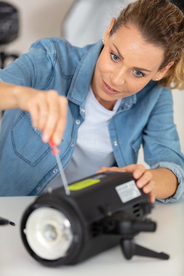 Young Woman Repairing Photography Studio Flash Stock Photo - Image of ...