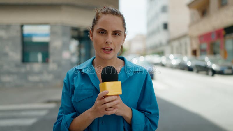 Young Woman Reporter Working Using Microphone at Street Stock Photo ...