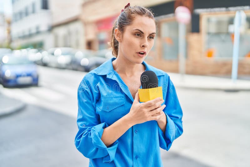 Young Woman Reporter Working Using Microphone at Street Stock Photo ...