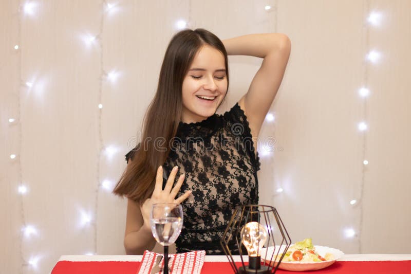 Young Woman in a Restaurant at a Table Smiling Stock Photo - Image of ...