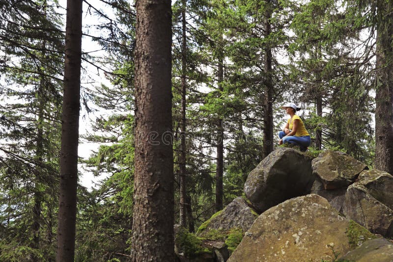 Young Woman Resting on Rocks Stock Image - Image of nature, enjoying ...